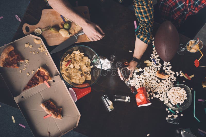 Man Holding Whiskey Bottle at Messy Table after Party Stock Image ...