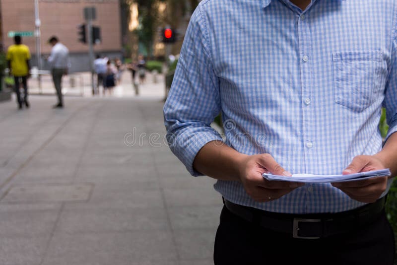 Man Holding White Paper Documents Stock Photo - Image of person, white ...