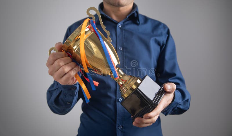 Man Holding a Winner Golden Trophy Cup Stock Image - Image of ...