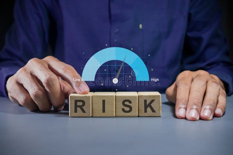 Man Holding Wooden Block with Risk Word and Risk Level Indicator on ...