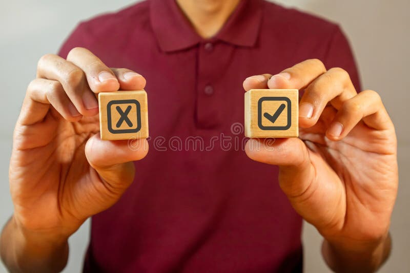 Man Holding Wooden Blocks with Yes No Icon or Correct Wrong Icon Stock ...