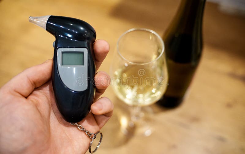 Man Holds an Alcohol Tester Stock Image - Image of display, hand: 264170111