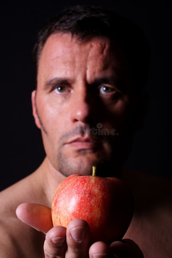 Man holds an apple stock photo. Image of apple, fruit - 16134866