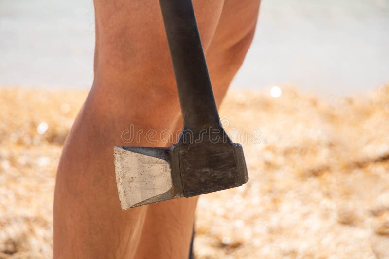 A Man Holds an Ax in His Hand. Stock Image - Image of holding ...