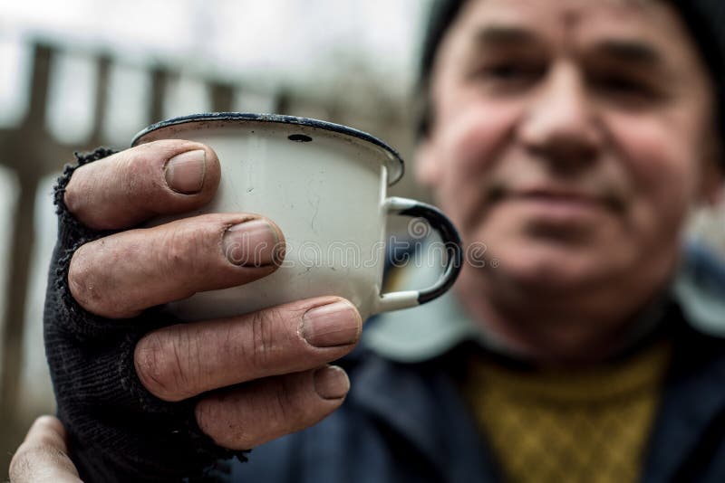 A Man Holds a Cup in an Outstretched Hand. Stock Photo - Image of holds ...