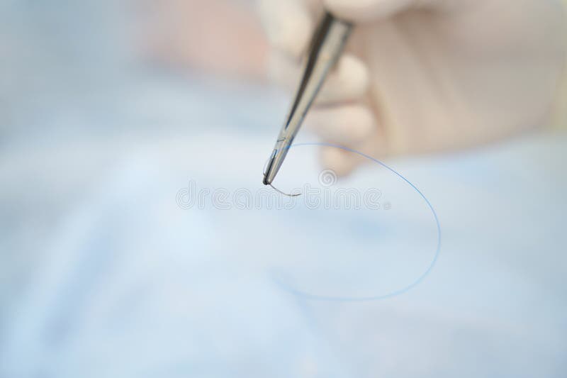 Man Holds in His Hand a Surgical Needle Stock Image - Image of ...