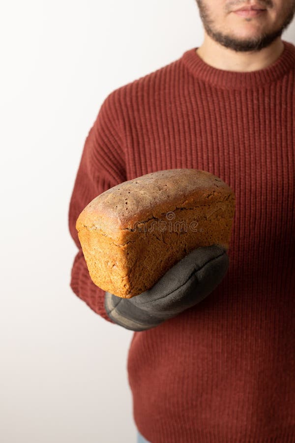 A Man Holds a Loaf of Homemade Rye Bread. Stock Photo - Image of bake ...