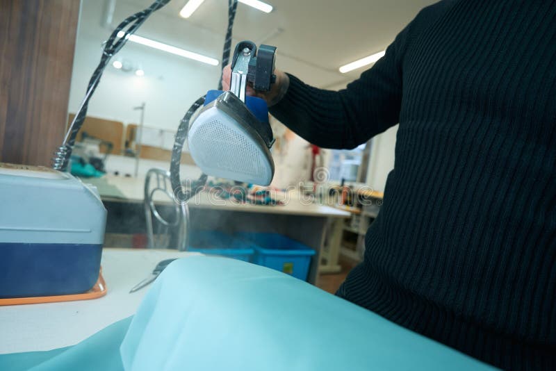 Man Holds a Modern Steam Iron in His Hands Stock Image - Image of ...