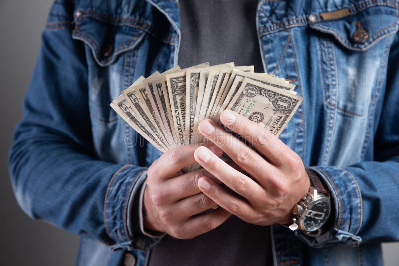 Man holds money and shows stock photo. Image of business - 215937468