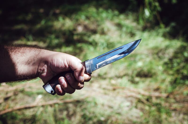 A Man Holds a Sharp Knife in His Hand Stock Photo - Image of holding ...