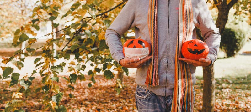 A Man Holds a Sick and Healthy Pumpkin in His Hands Stock Photo - Image ...