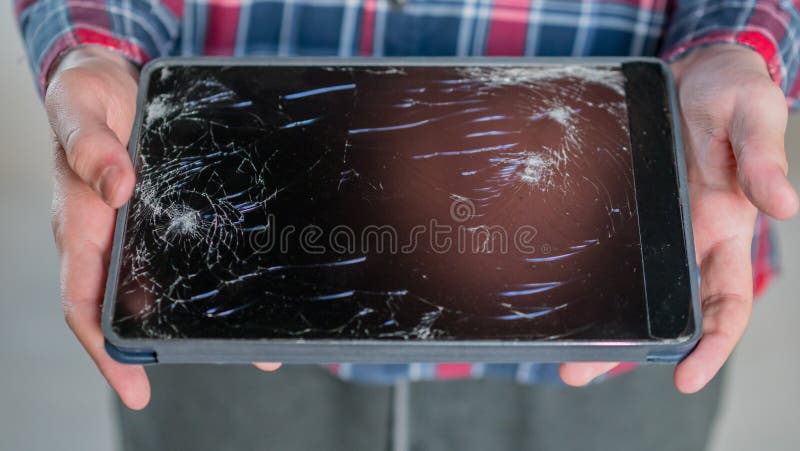 A Man Holds a Tablet with a Broken Screen Stock Image - Image of person ...
