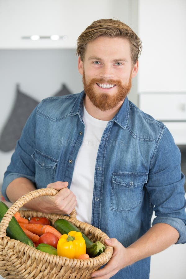 Man Holds Veggies in Basket Stock Photo - Image of veggies, wicker: 308149440