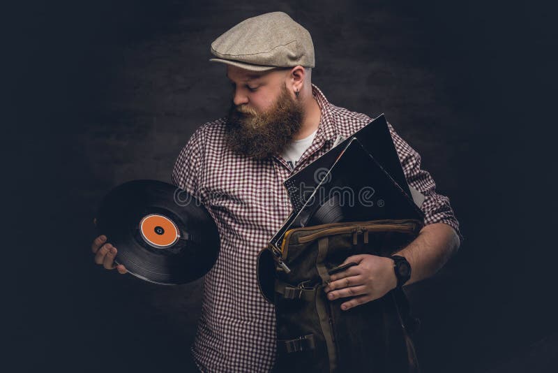 A man holds vinyl records. stock photo. Image of guys - 111691218