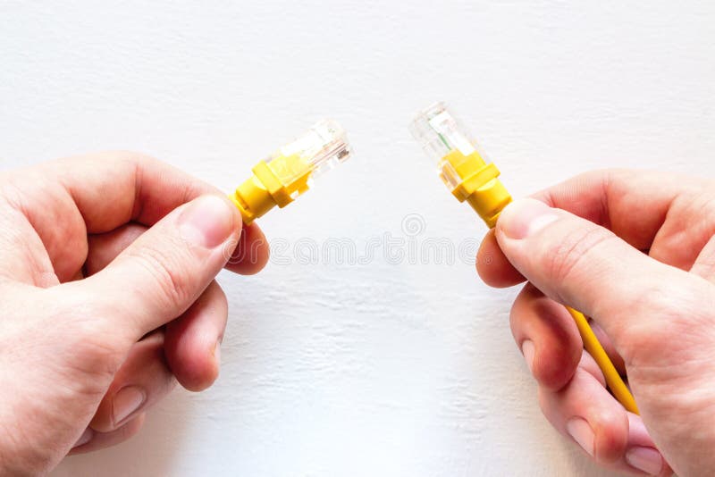 Man Holds Yellow Network Internet Cable Stock Image - Image of laptop ...