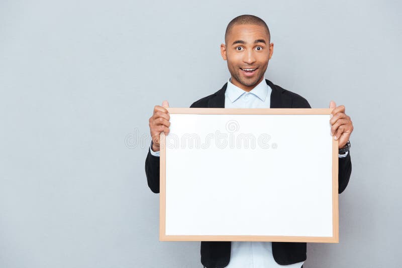 Man holsing whiteboard stock photo. Image of confidence - 72926476