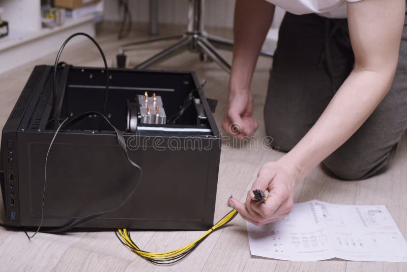 A Man at Home Collects, Disassembles a Computer. Hands of a Man Hold ...