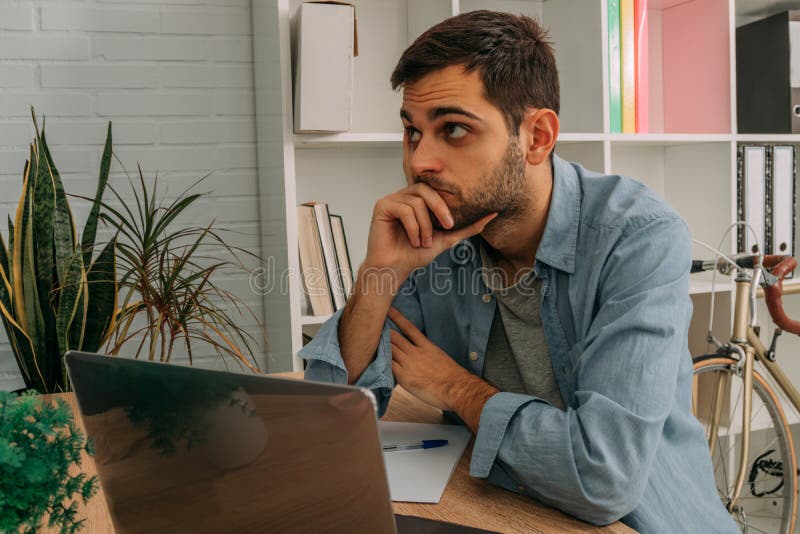 Man at Home with Computer Thoughtful Stock Photo - Image of making ...