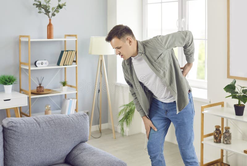 Man at Home Feeling Sudden Bad Muscles Pain Attack, Holding Back ...