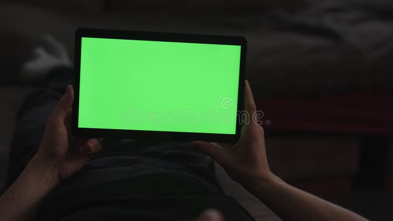 Man at Home Lying on a Couch with Tablet Pc with Green Screen Stock ...