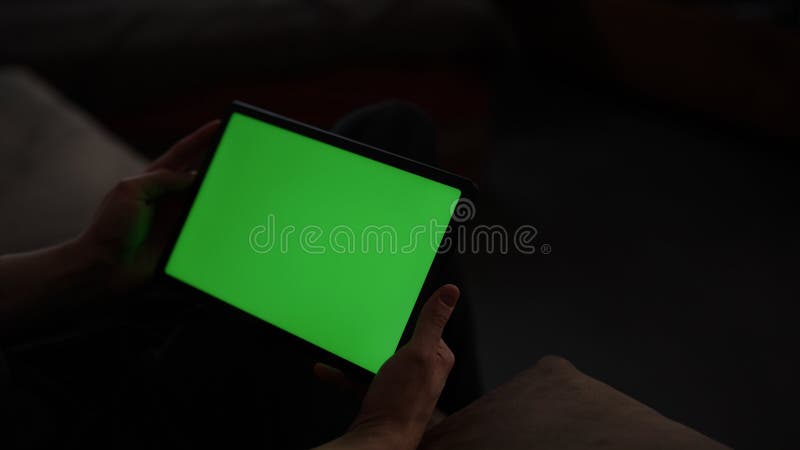 Man at Home Lying on a Couch with Tablet Pc with Green Screen Stock ...