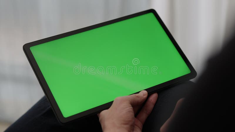 Man at Home Lying on a Couch with Tablet Pc with Green Screen Stock ...