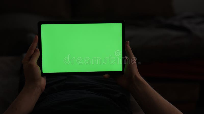 Man at Home Lying on a Couch with Tablet Pc with Green Screen Stock ...