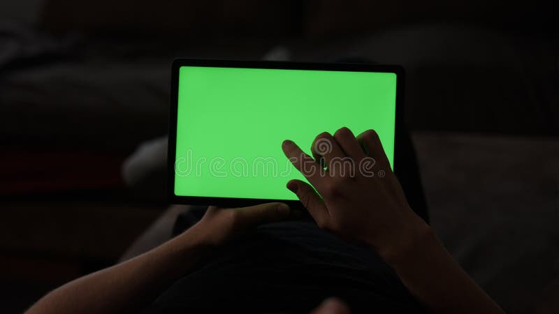 Man at Home Lying on a Couch with Tablet Pc with Green Screen Stock ...