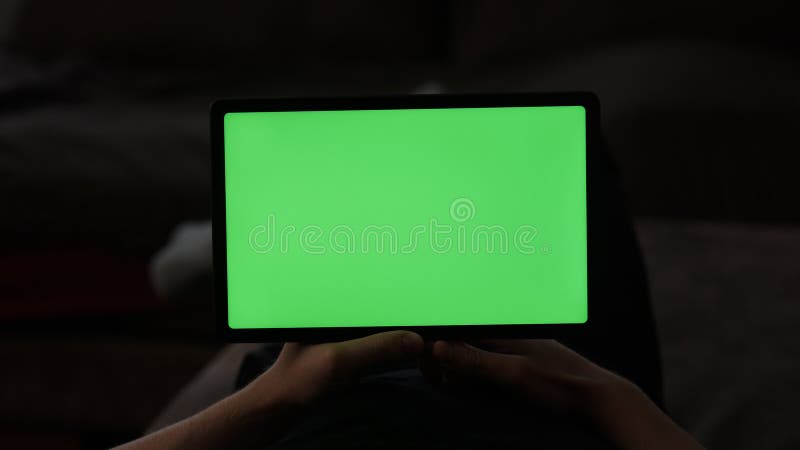 Man at Home Lying on a Couch with Tablet Pc with Green Screen Stock ...