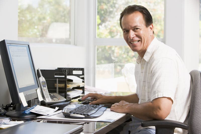 Man in Home Office at Computer Smiling Stock Photo - Image of sitting ...