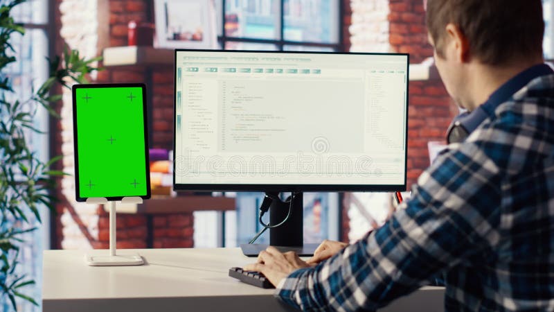 Man in Home Office Fixing Errors in Application Using Chroma Key Device and PC Stock Video ...