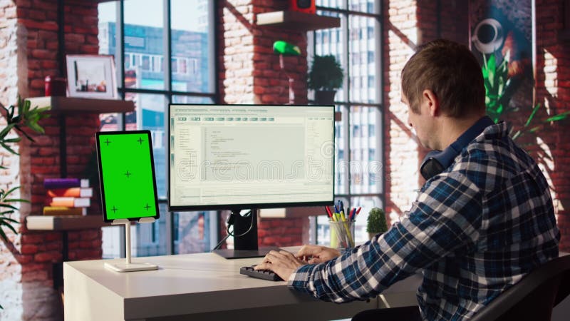 Man in Home Office Fixing Errors in Application Using Chroma Key Device and PC Stock Video ...