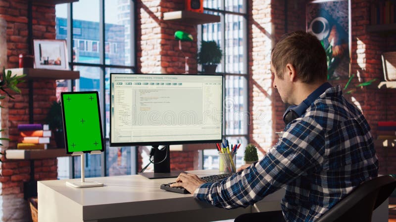 Man in Home Office Fixing Errors in Application Using Chroma Key Device and PC Stock Image ...