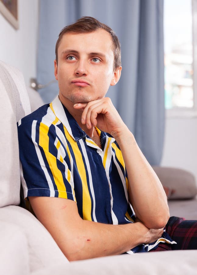 Man in home stock image. Image of smiling, sofa, young - 219283979