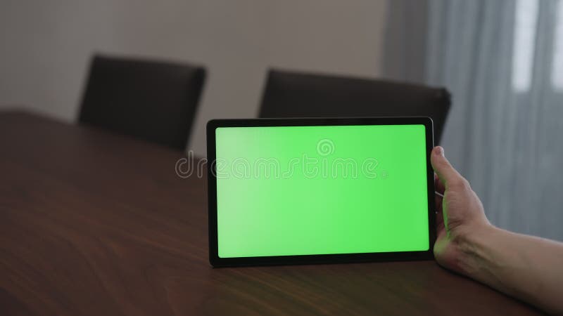 Man at Home Using Tablet Pc with Green Screen while Sitting at the ...