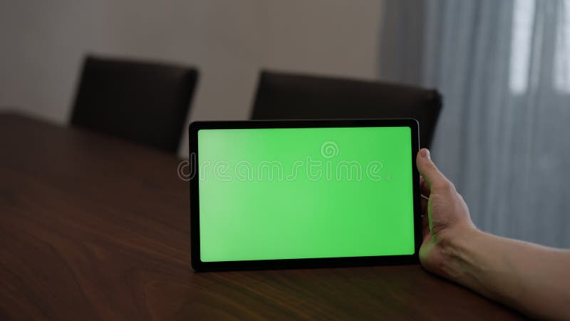 Man at Home Using Tablet Pc with Green Screen while Sitting at the ...