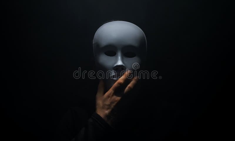 Man takes off his mask stock image. Image of concept - 257476697
