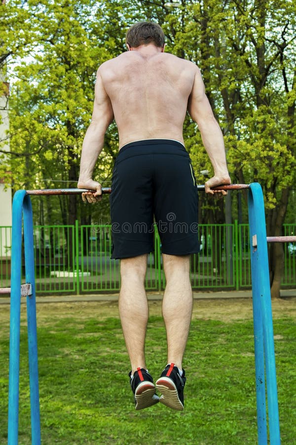 Man and horizontal bar stock photo. Image of bodybuilding - 55248454
