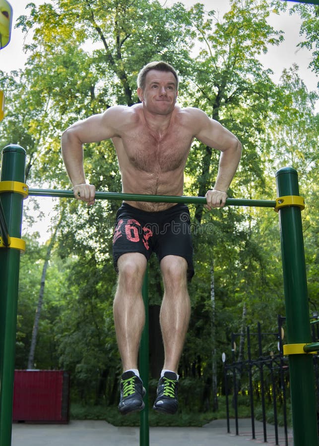 Man and horizontal bar stock photo. Image of horizontal - 56328390