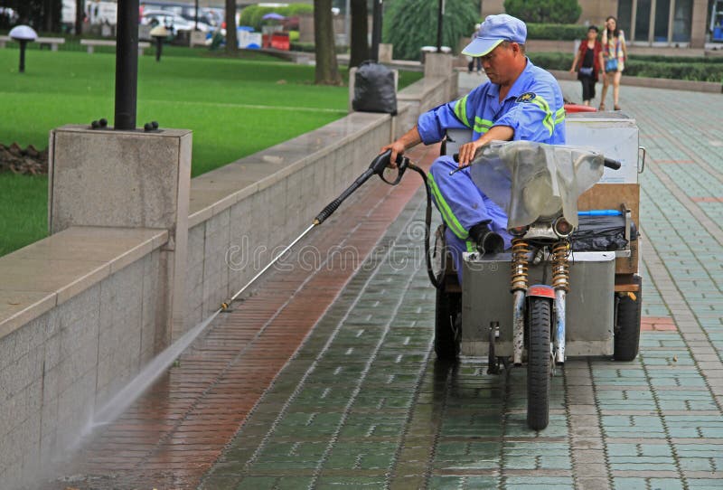 Man is Hosing Pavement in Shanghai Editorial Photography - Image of ...