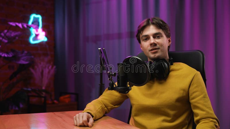Man Host in Headphones Sitting at Table and Recording Interview Video ...