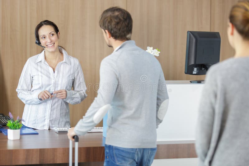 Man at hotel reception stock photo. Image of receptionist - 259239834