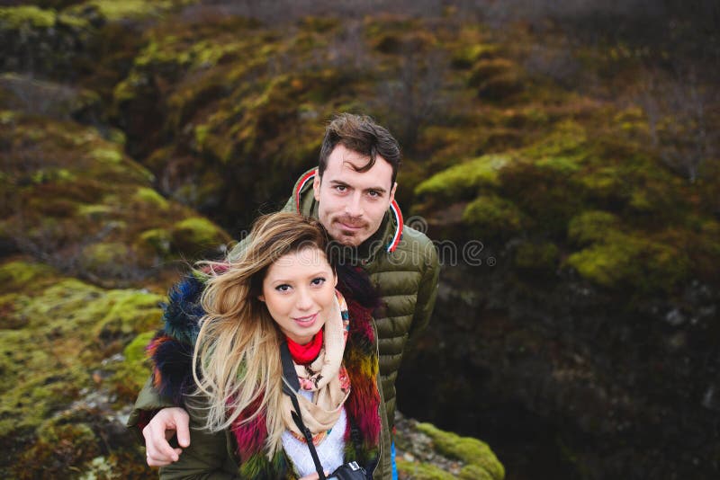 Man Hugging Woman in Wind stock image. Image of travel - 83427651