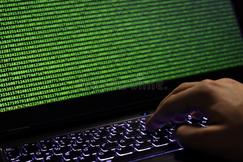 Man is Illuminated by the Glow of His Computer Screen As he Types on ...