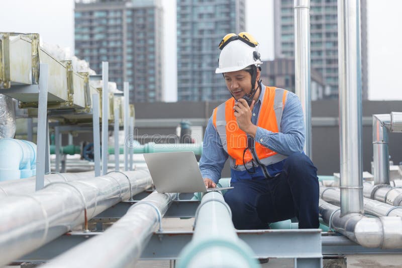 Man Industrial Engineer Using Walkie Talkie and Laptop Working at ...