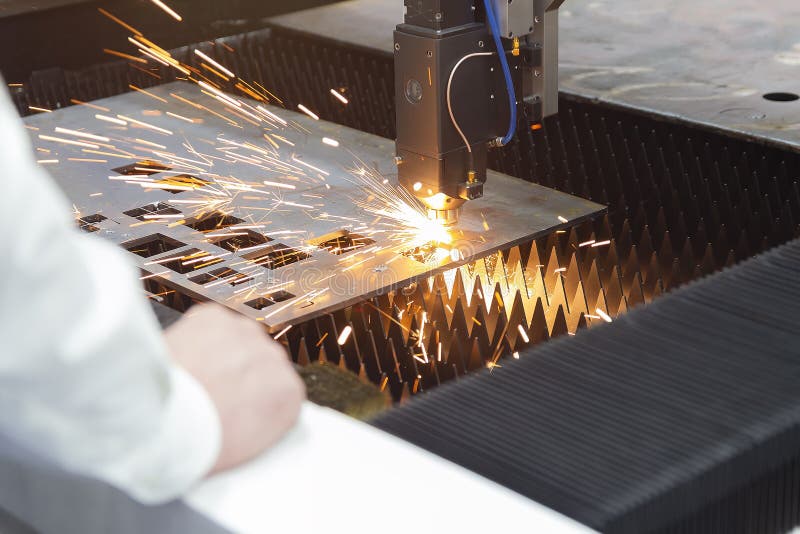 A Man in the Industrial Laser Cutting of Sheet Metal Stock Photo ...