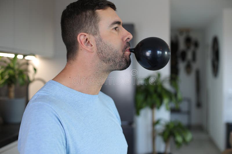 Man Inflating an Air Balloon Stock Image - Image of hairstyle ...