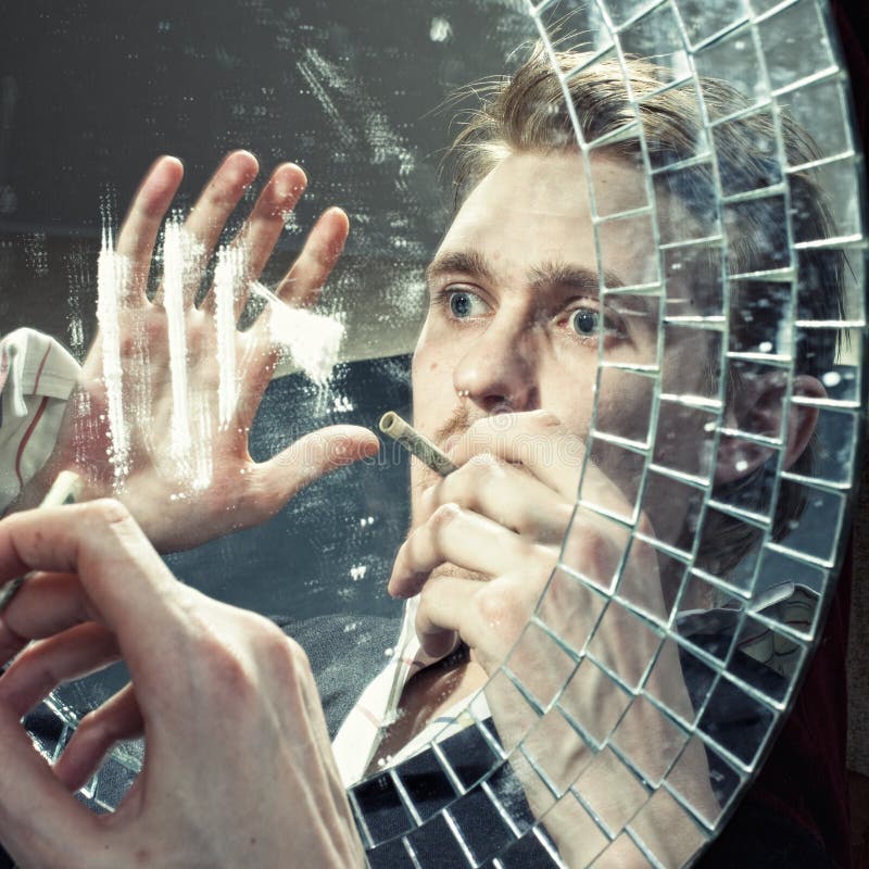Man Inhaling Cocaine Powder on a Mirror Stock Photo - Image of ...