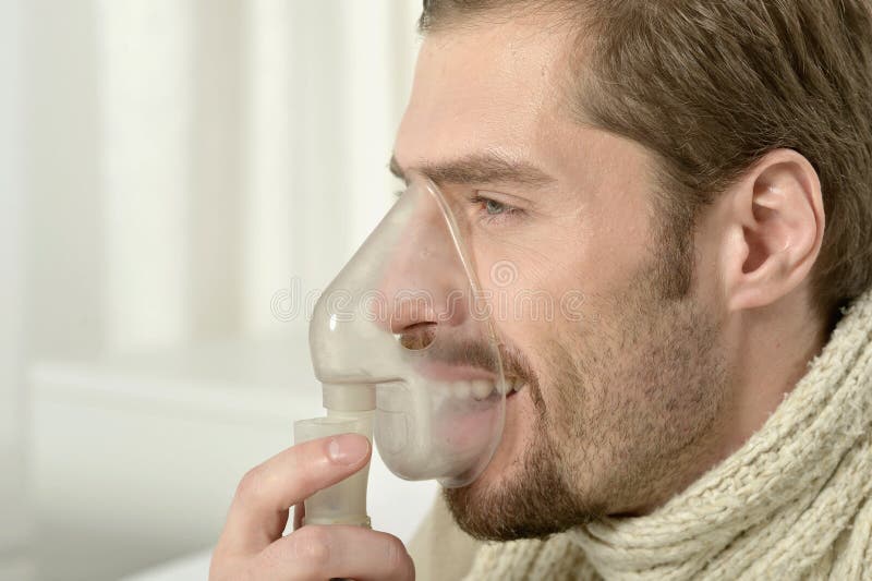 Man Inhaling through Inhaler Mask Stock Image - Image of person, oxygen ...