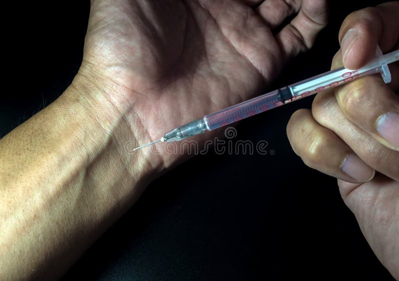 Man with Syringe To His Hand Stock Image - Image of addict, holding ...